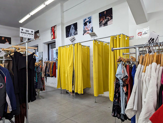 Bright yellow fitting rooms where fashion dreams either come true or teach you valuable lessons about pants.