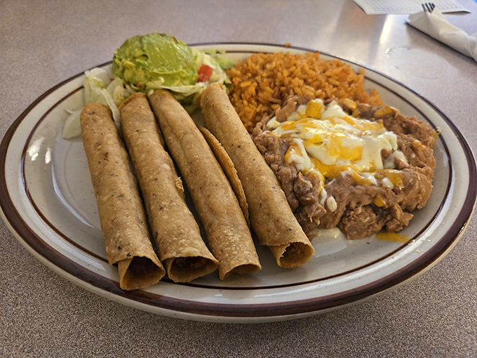 Flautas lined up like delicious cigars that won't kill you—unless you count dying of happiness as a legitimate cause of death.