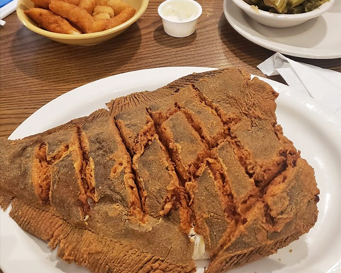 This isn't just fried flounder—it's a golden-brown testament to seafood done right. The cross-hatching isn't just pretty; it's a flavor delivery system.
