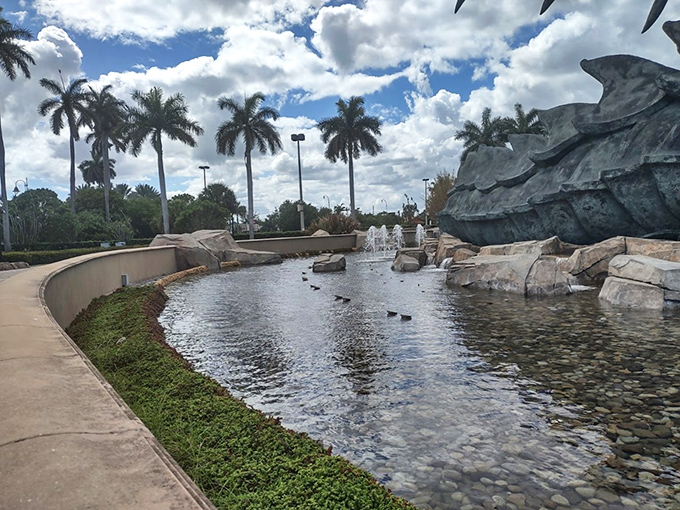 Tranquil waters reflect the epic battle above, creating a moment of zen beneath all that mythological drama.