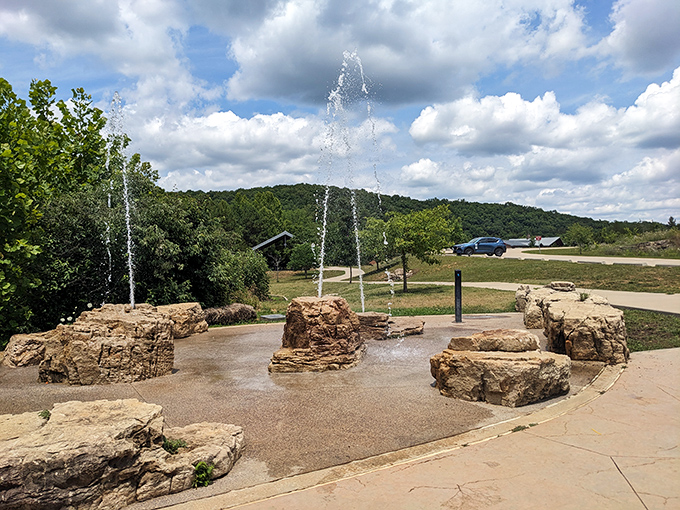 The splash pad fountains provide welcome relief on hot summer days, proving that even rocks can have a playful side.