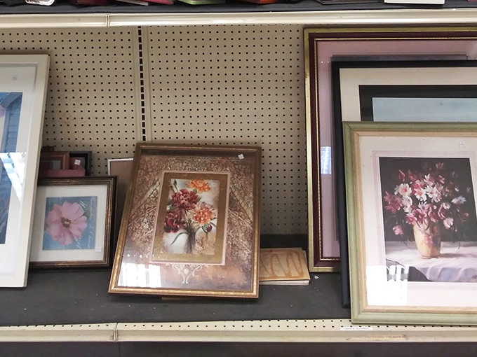 The art gallery corner, where framed florals and landscapes await adoption. That middle piece could be the perfect solution for that empty wall above your sofa.