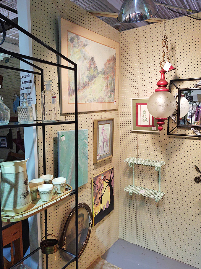 Art and lighting combine to create a gallery-like atmosphere. That vintage pendant lamp is practically begging to illuminate your reading nook.