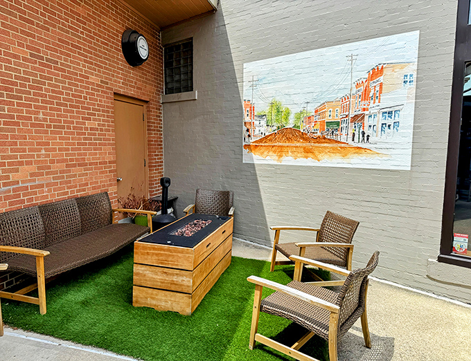 An outdoor nook where artificial turf meets genuine relaxation, with a mural that reminds you you're in a town with stories to tell.