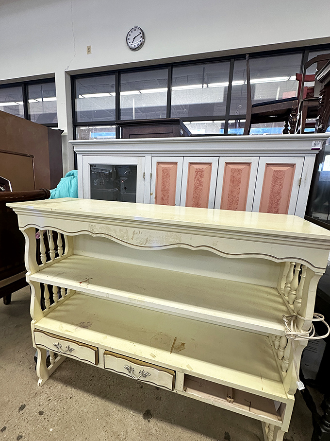 This cream-colored shelving unit is somebody's decluttering win and your potential living room centerpiece shortly.