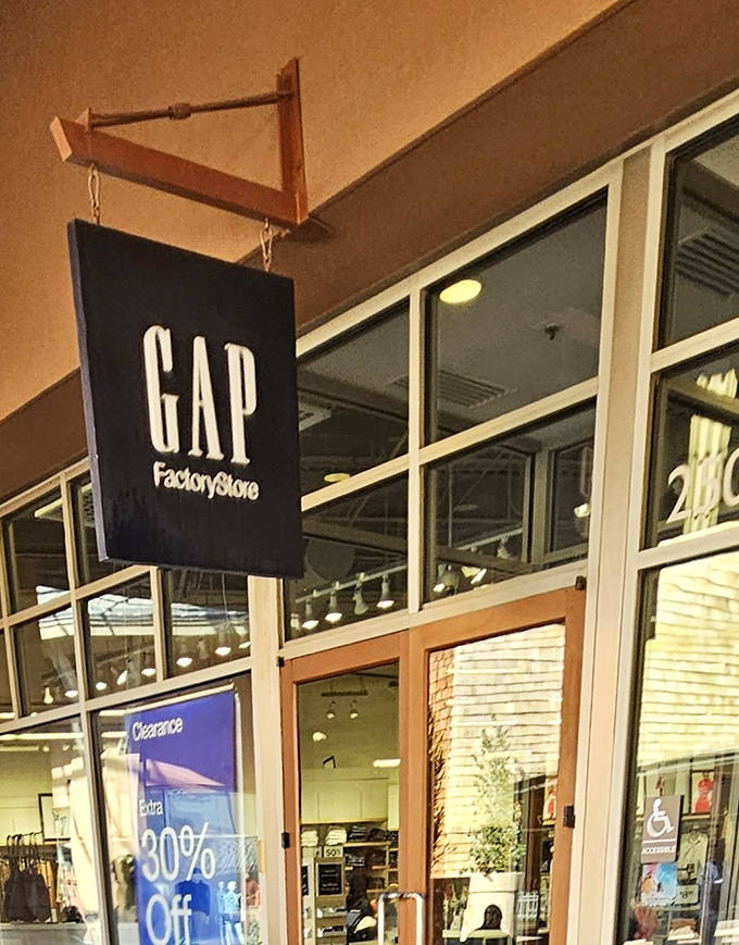 Gap Factory Store hangs its banner with quiet confidence, knowing everyone needs reliable basics that don't require payment plans.