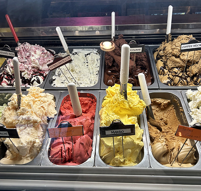 A rainbow of gelato flavors stands at attention, each scoop promising a cool, creamy finale to your Italian feast.