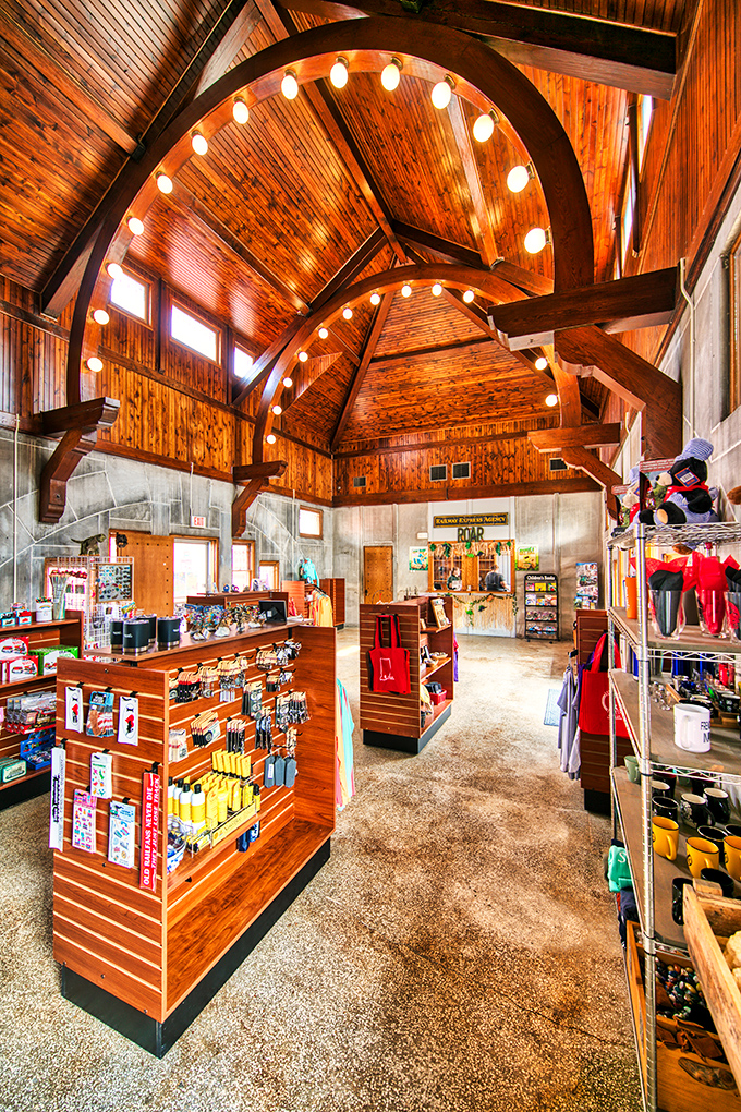 The gift shop's soaring wooden ceiling and warm lighting create a cathedral-like space for train enthusiasts to find their perfect souvenir.