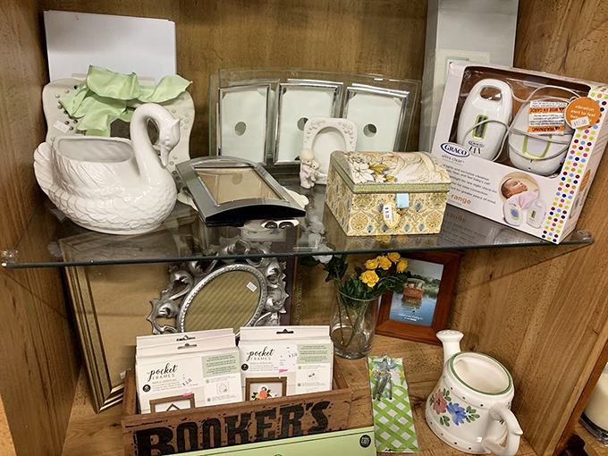 A shelf of possibilities&mdash;from ceramic swan planters to silver picture frames waiting to hold new memories. Marie Kondo would not approve of how much joy these spark.