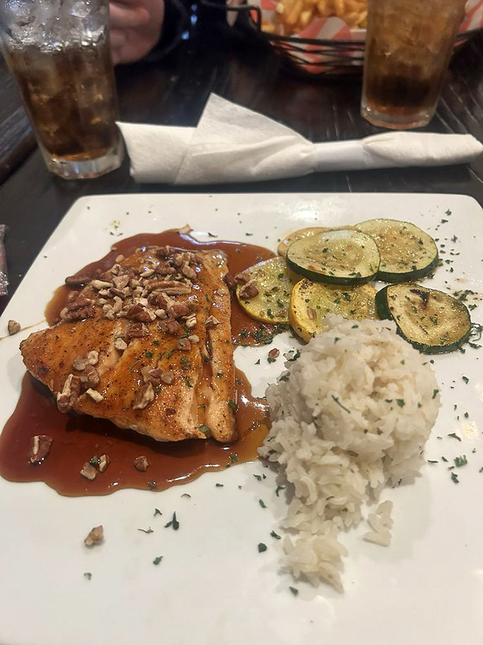 Bourbon salmon that's dressed for success with pecan accessories and sides that know their supporting role.