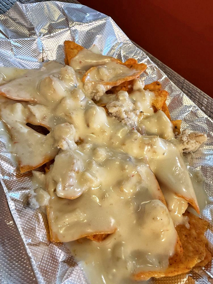 These nachos aren't just covered in cheese—they're smothered in the kind of cheesy affection your grandmother would approve of.