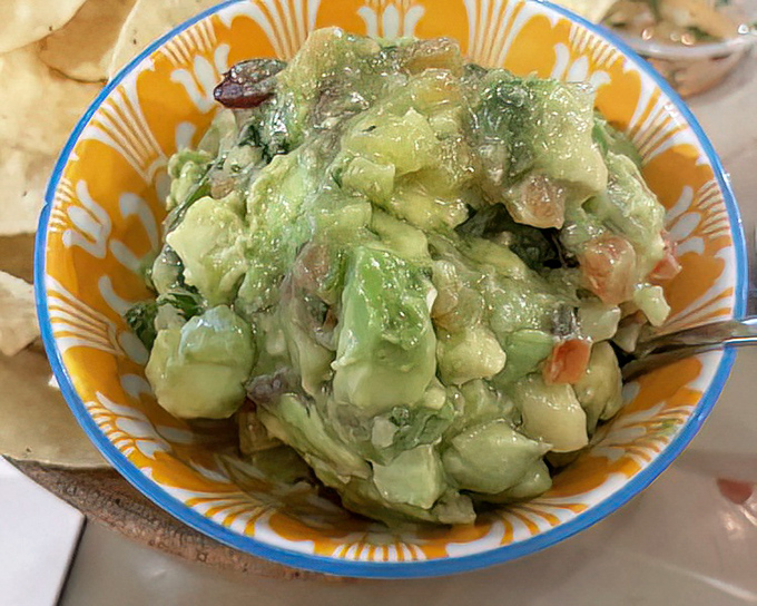 This isn't just guacamole; it's a green masterpiece of perfectly ripened avocados, diced tomatoes, and cilantro that makes store-bought versions hang their heads in shame.