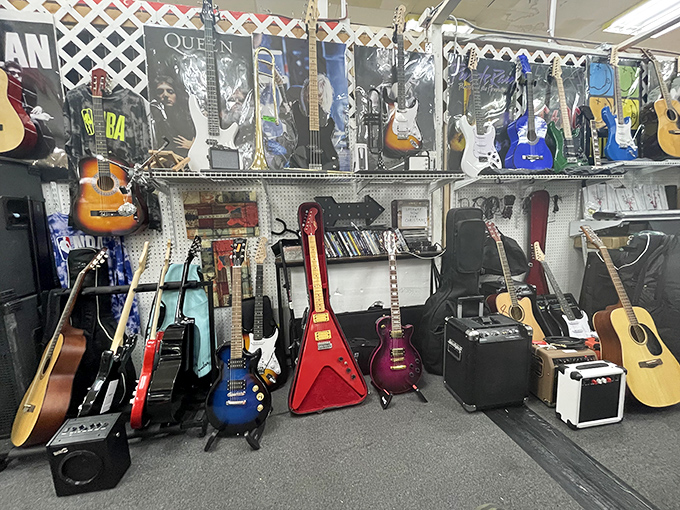 A guitar gallery where rock star dreams are born. That red Flying V is practically screaming "Sweet Child O' Mine."