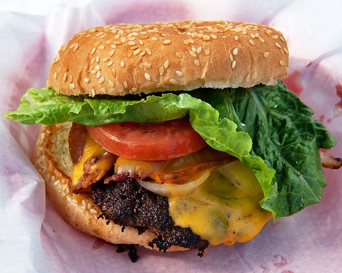 This isn't just a burger&mdash;it's edible architecture. The precise layering of cheese, meat, and fresh veggies creates a harmony that fast food chains can only dream about.