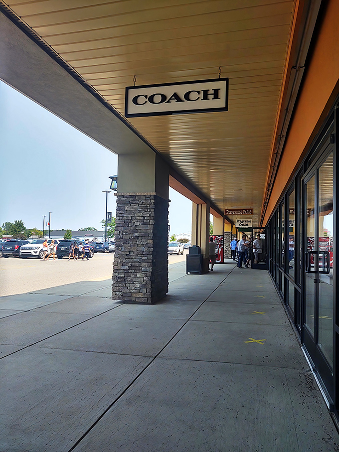 The Coach storefront beckons with understated elegance. That iconic sign has caused more rapid heartbeats than a cardiologist's waiting room.