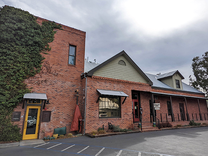 This brick building with ivy-covered walls houses one of Sutter Creek's beloved establishments, blending rustic charm with Gold Country history.