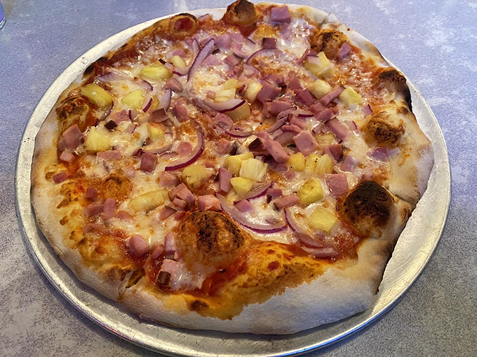 Hawaiian pizza that would make even the most ardent pizza purists reconsider their stance on the pineapple debate.