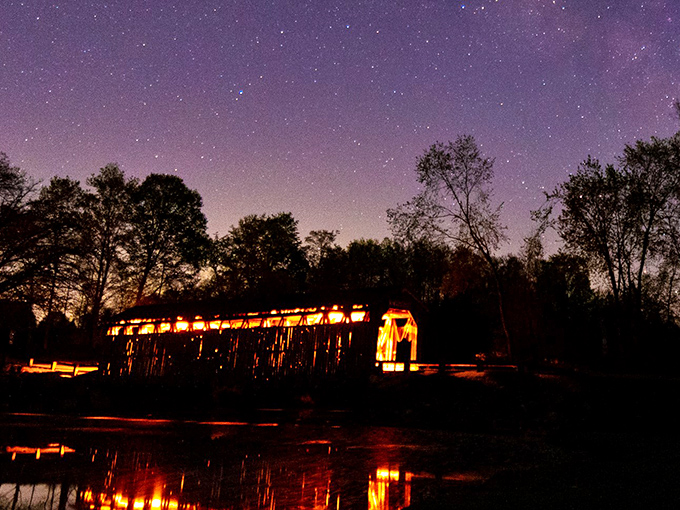 Under starry skies, the illuminated bridge takes on an almost magical quality &ndash; history that glows in the Michigan darkness.