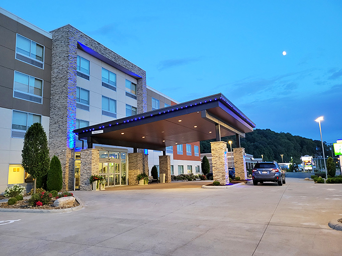 The Holiday Inn Express glows with evening hospitality, a modern comfort zone nestled among the rolling hills of Holmes County.