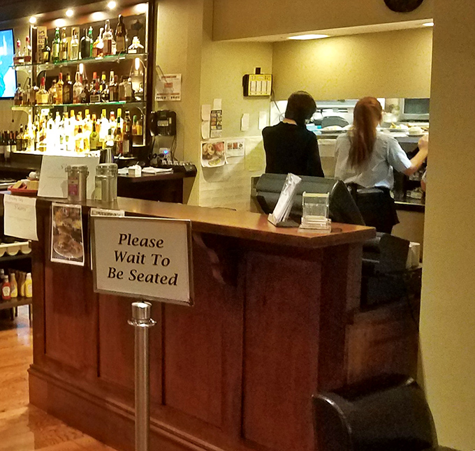 "Please Wait To Be Seated" &ndash; four words that promise good things come to those who wait, especially with that well-stocked bar in view.