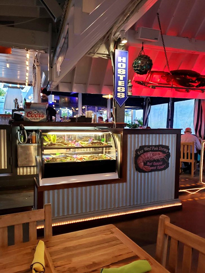 The seafood display case showcases the day's ocean bounty, a glass-fronted preview of coming attractions for your taste buds.