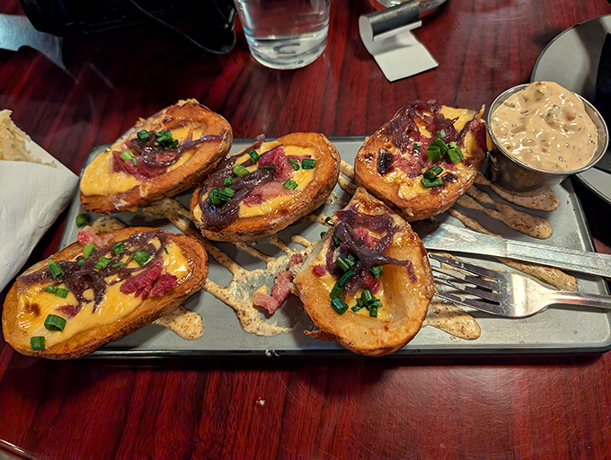 Potato skins that put sports bars to shame. These crispy vessels of bacon, cheese and green onion goodness demand to be shared.