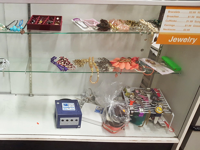 Behind glass, costume jewelry awaits its next performance. Those beaded necklaces and vintage brooches aren't just accessories&mdash;they're conversation pieces with previous lives.