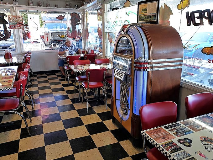 The vintage jukebox stands sentinel in the corner, ready to provide the soundtrack to your meal&mdash;because every great burger deserves its own theme music.