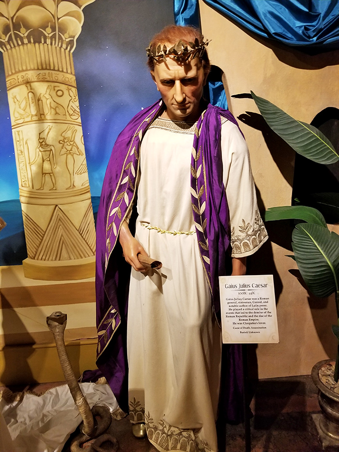 Julius Caesar strikes a noble pose, his expression suggesting he's just spotted someone wearing socks with sandals and is not impressed.