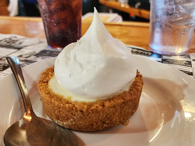 The key lime pie arrives with a cloud of whipped cream that would make Florida jealous. The perfect sweet ending to your island feast.