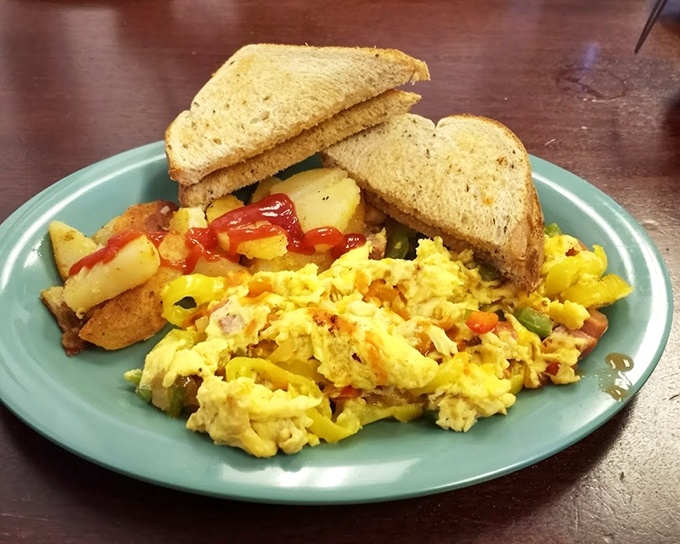A breakfast plate that says "good morning" in the universal language of fluffy scrambled eggs, home fries, and perfectly toasted bread. 