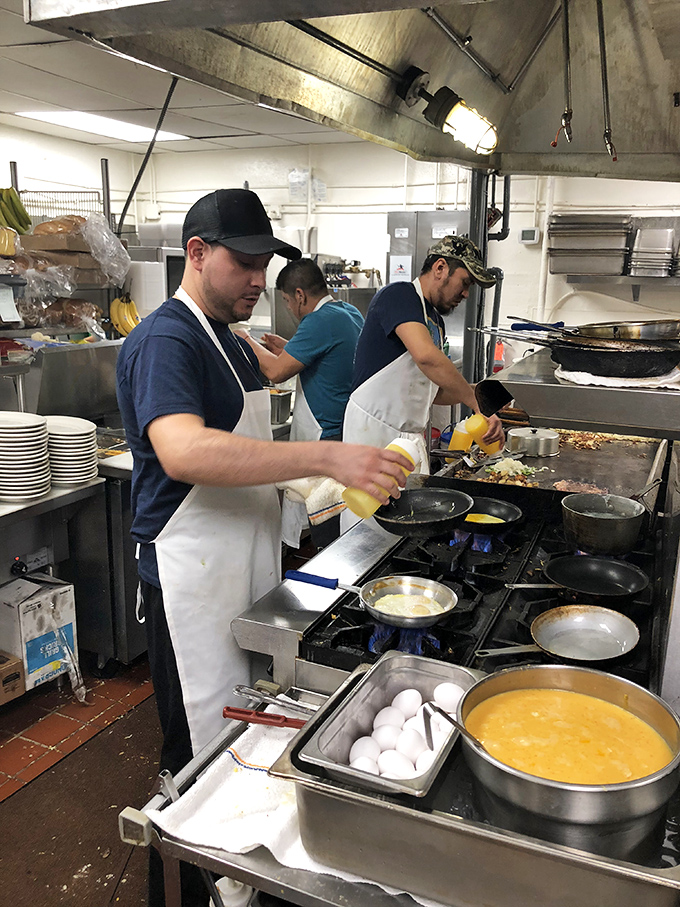 The kitchen ballet &ndash; where breakfast dreams come true through practiced movements and a well-seasoned griddle. Those eggs don't flip themselves, folks.