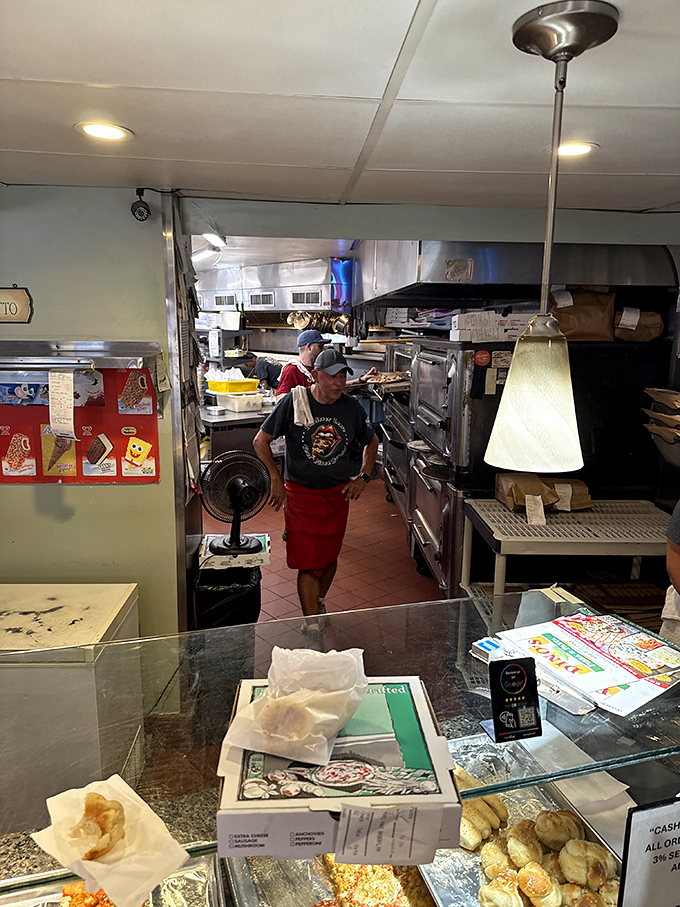 A glimpse into the kitchen where the magic happens. Like watching backstage at a Broadway show, but with more cheese and tomato sauce.