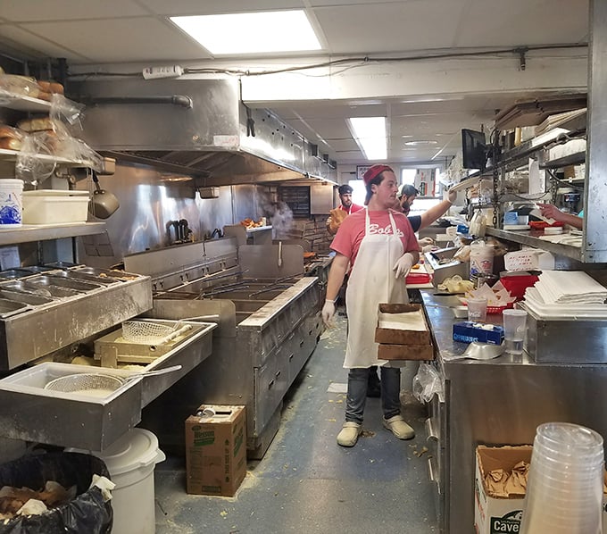 Behind the scenes where the real heroes work their deep-frying wizardry, turning fresh seafood into crispy baskets of pure coastal joy.