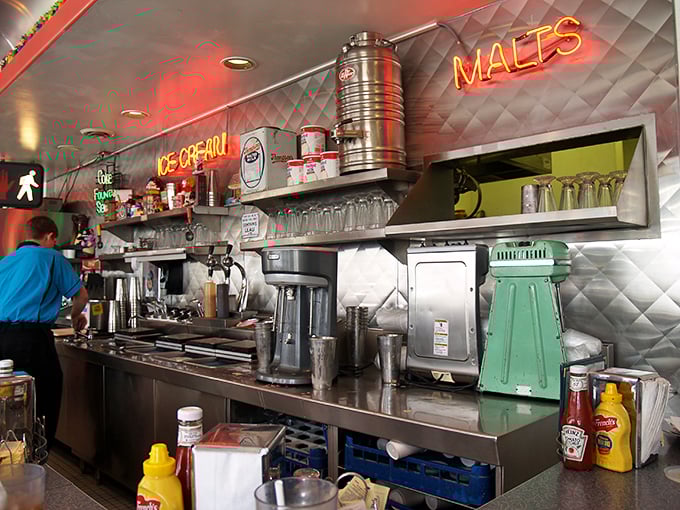 The kitchen&mdash;where magic happens amid stainless steel, neon signs, and equipment that's been perfecting comfort food for generations.
