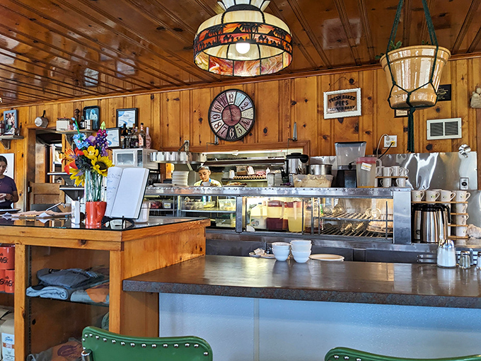 Sunflowers brighten the counter space where coffee brews and orders fly, the heart of this breakfast institution's morning rhythm.