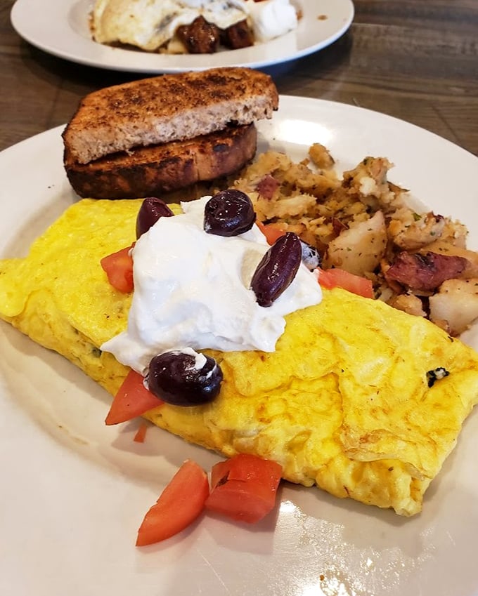 This omelet, topped with fresh ingredients and a dollop of sour cream, is what breakfast aspires to be when it grows up.