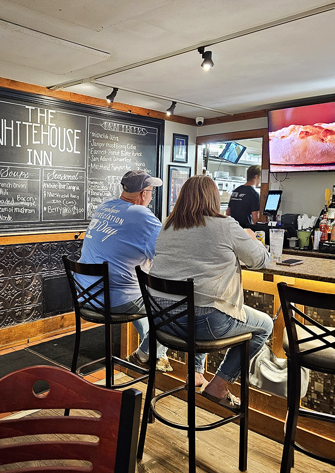 Where kitchen magic happens. The chalkboard reveals treasures like French onion soup and carrot cake&mdash;comfort food that's stood the test of time. 