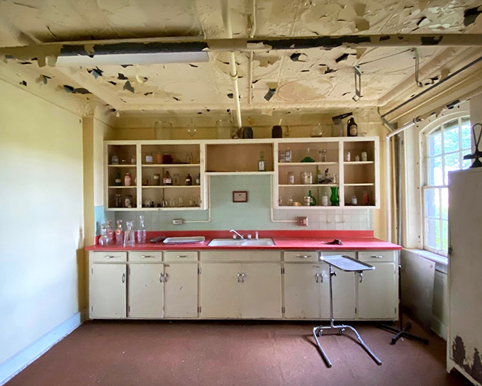 The medical lab frozen in time. Cabinets still stocked with mysterious bottles hint at treatments that modern medicine has long since abandoned.