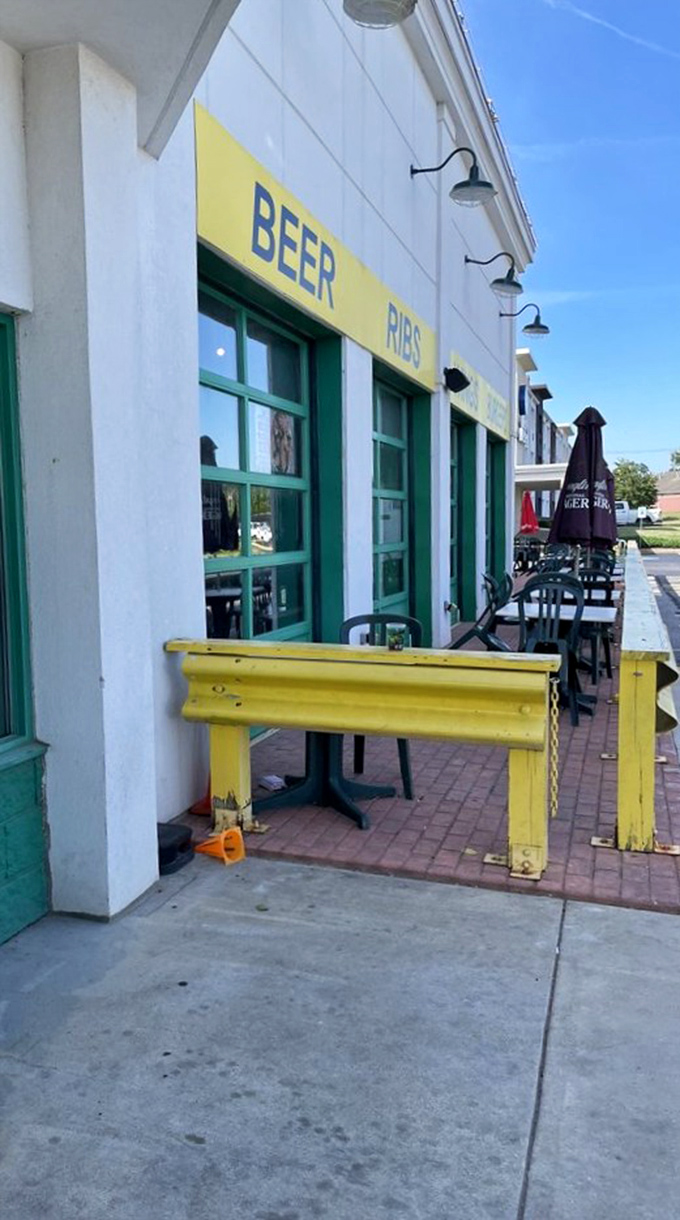 Even the outdoor seating area stays on theme with that yellow guardrail—because at Quaker Steak & Lube, every detail drives home the automotive experience.