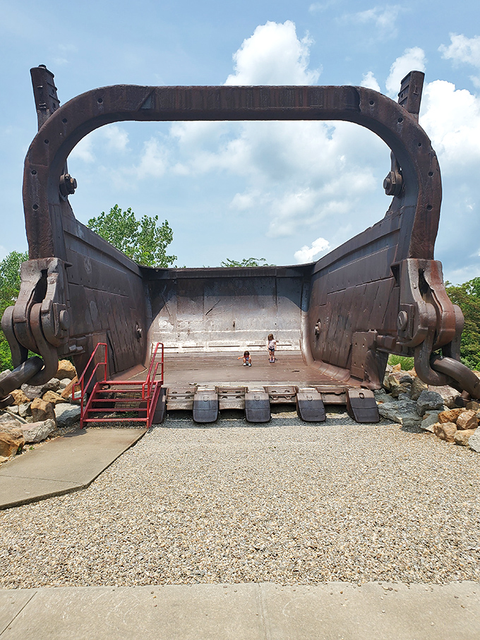 Even the smallest visitors stand in awe of this industrial giant, creating a perfect "honey, I shrunk the kids" moment.