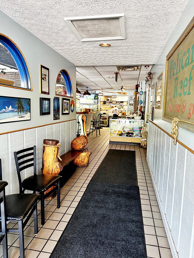 The entrance hallway sets the nautical stage with its light blue walls and maritime accents. Consider it a portal to somewhere decidedly un-Ohio.