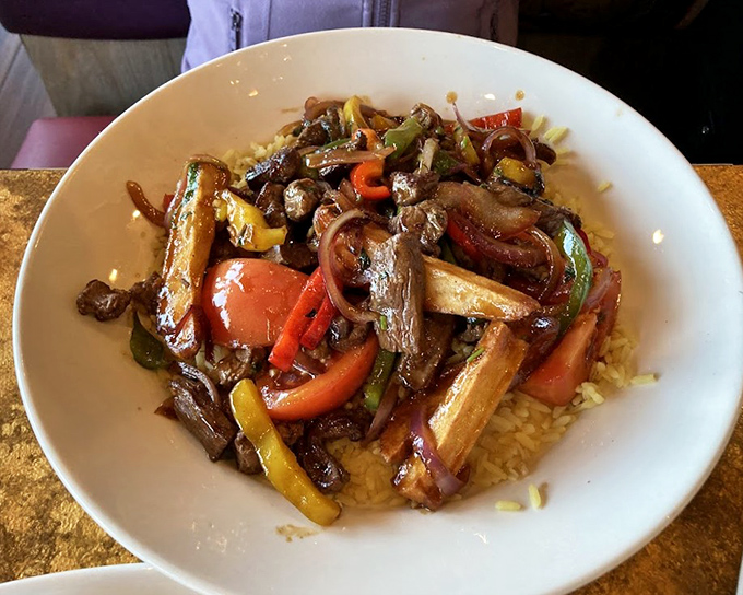 Lomo Saltado brings Peru to New Jersey&mdash;tender beef strips dancing with colorful peppers and onions atop a bed of rice. A passport for your palate.