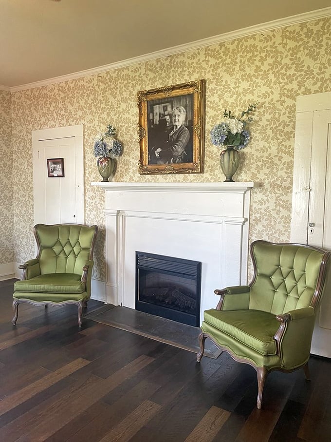 The parlor where sweet tea and conversation flow with equal ease&mdash;green wingback chairs practically begging for post-meal storytelling.