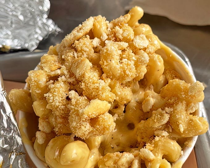 Mac and cheese with that golden crumb topping isn't just comfort food&mdash;it's therapy that doesn't require a co-pay.