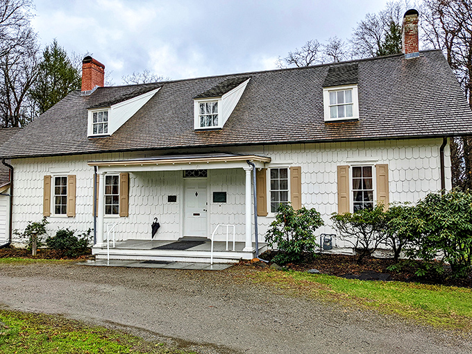 The Madam Brett Homestead whispers tales from centuries past, its white clapboard and dormer windows framing a simpler time.