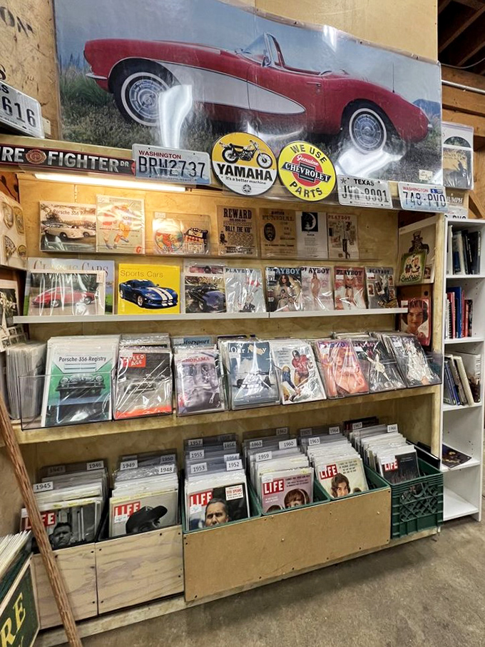 Corvettes, license plates, and magazines that would make your mother blush. This booth is a time capsule of American obsessions, neatly categorized.