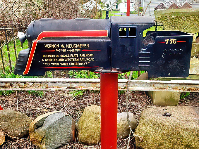 Even the mailbox gets the artistic treatment here &ndash; a locomotive tribute to a railroad engineer with the sage advice to "do your work cheerfully!"