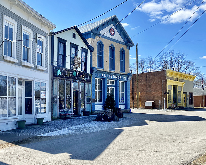 Sunlight bathes the colorful storefronts of Metamora's main drag, where the "One of a Kind" shop lives up to its name among equally distinctive neighbors.