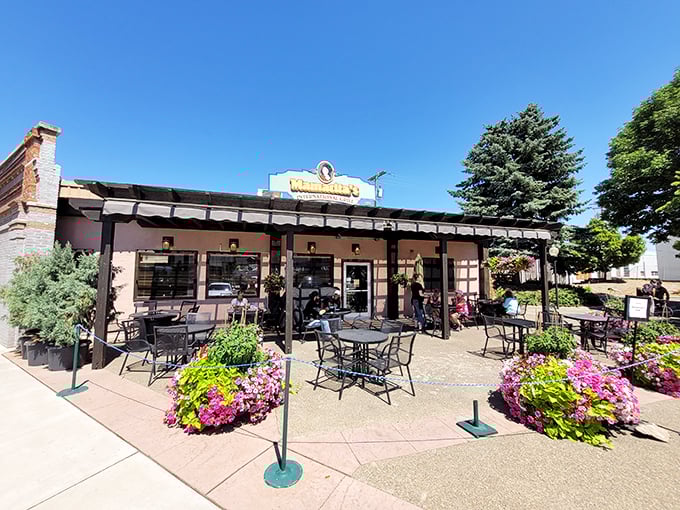 Outdoor dining at its finest, where colorful flowers compete with the menu for your attention &ndash; and both are winning.